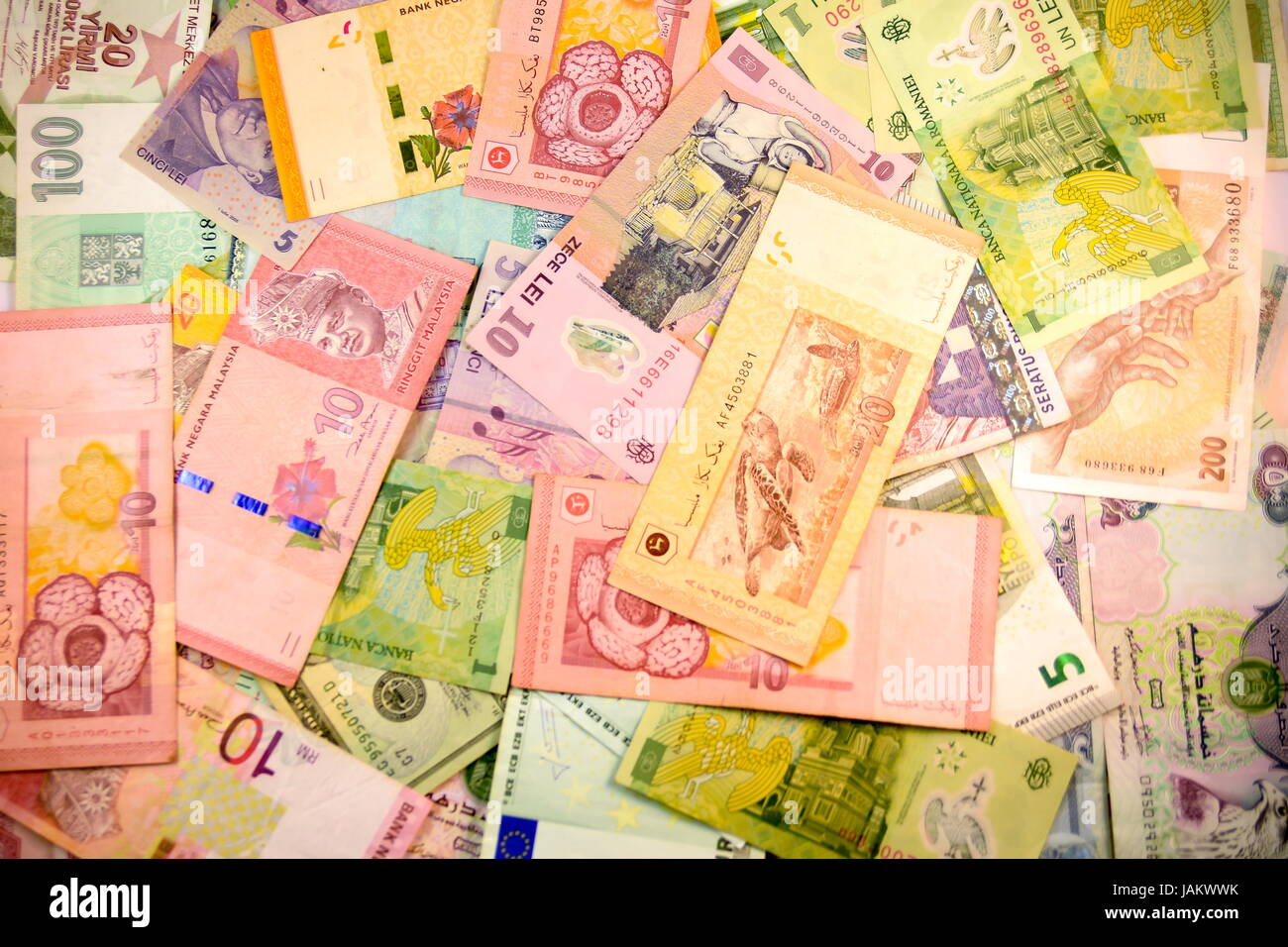 Different currency note and coins from different countries background ...