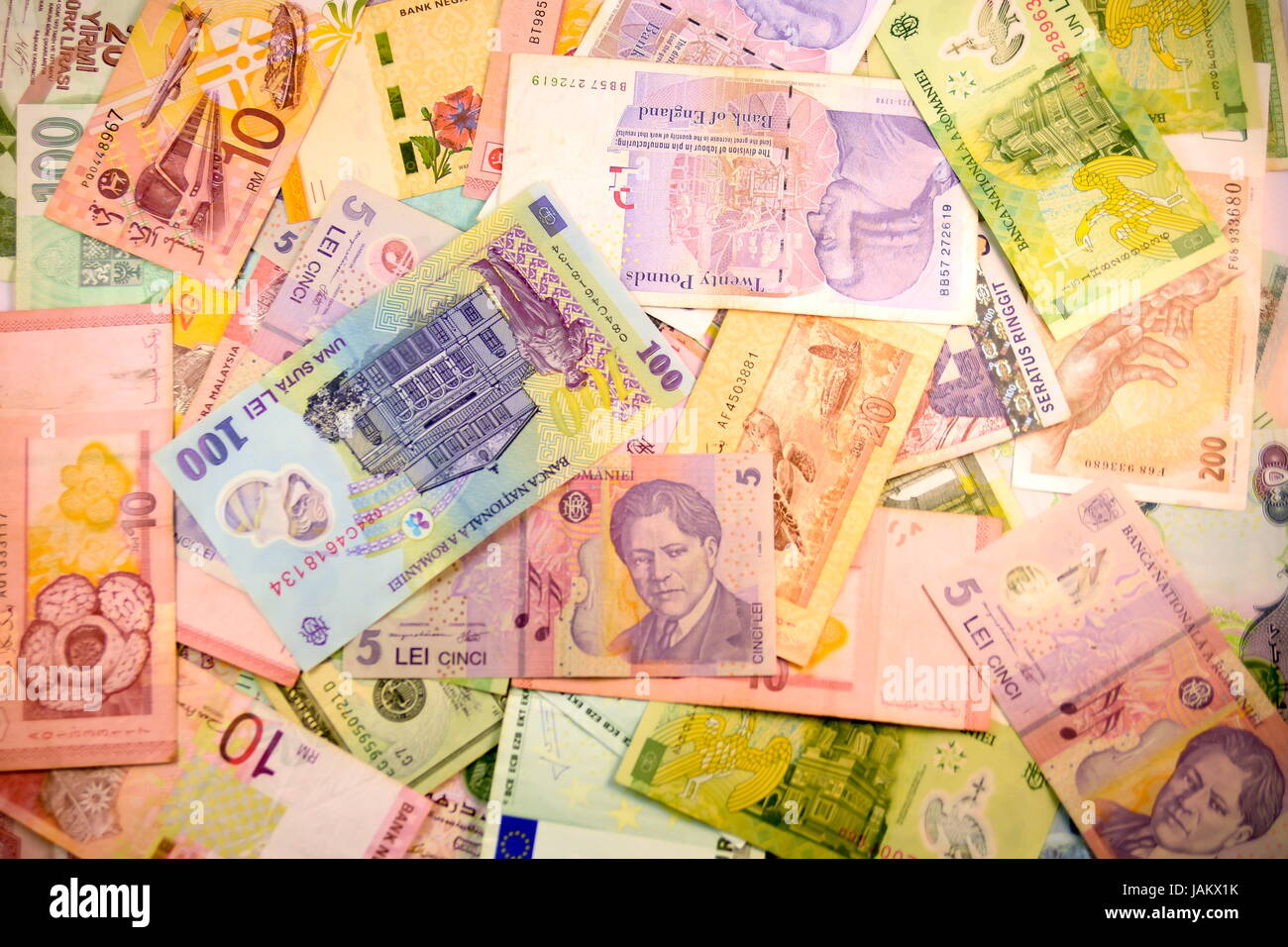 Different currency note and coins from different countries background ...