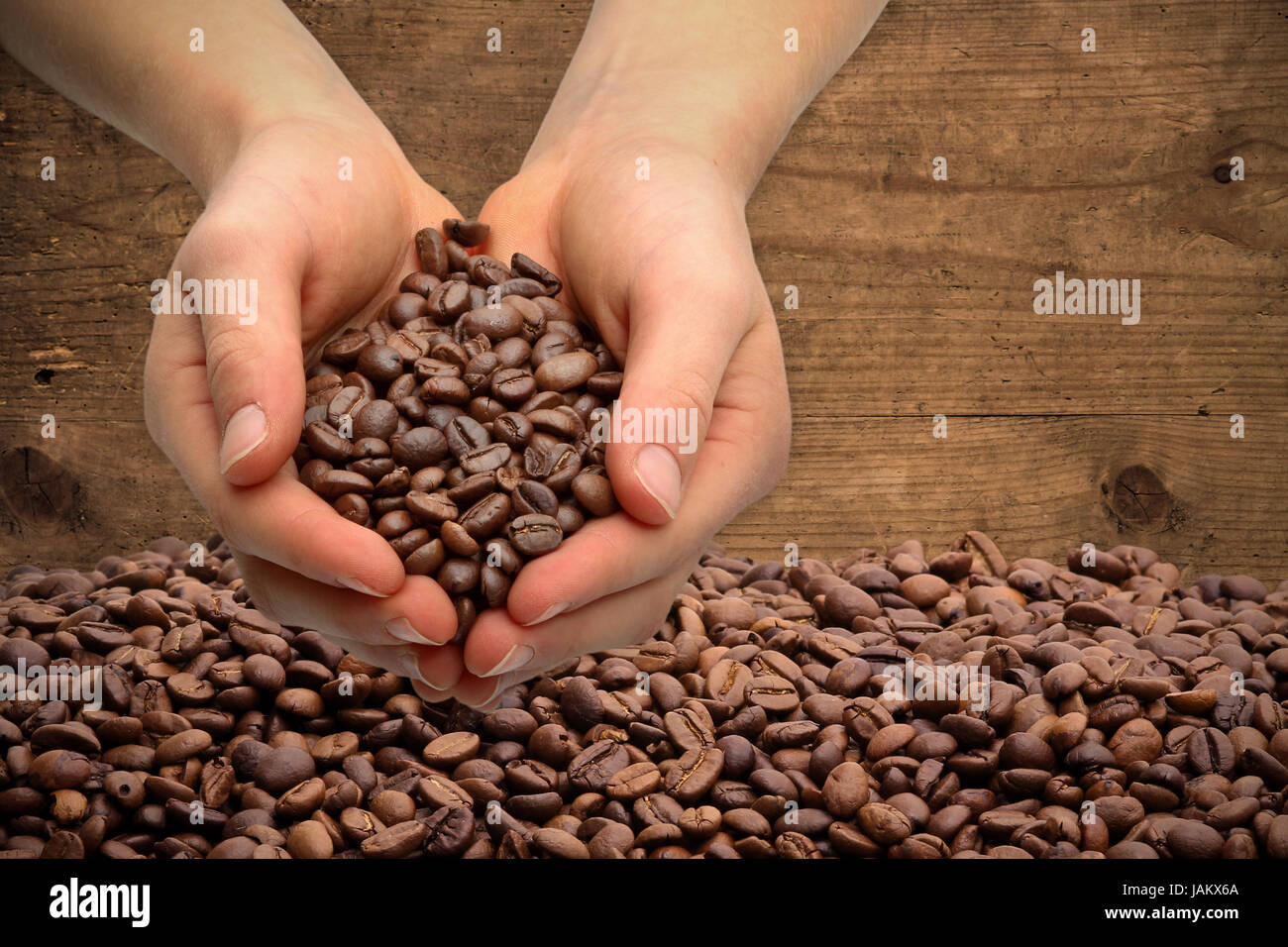 hands with coffee beans Stock Photo - Alamy
