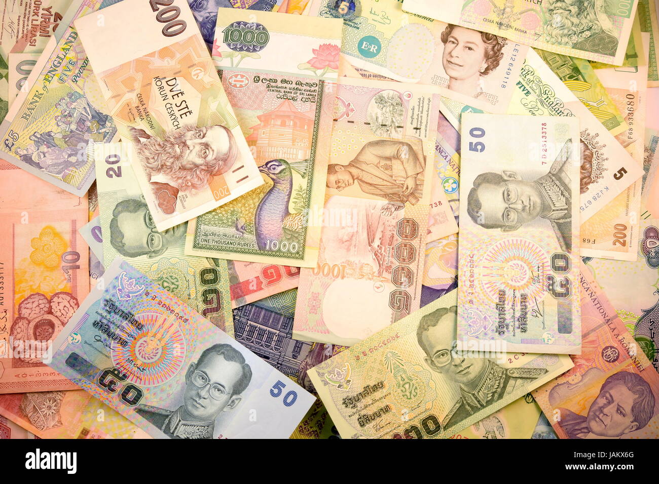 Different currency note and coins from different countries background ...