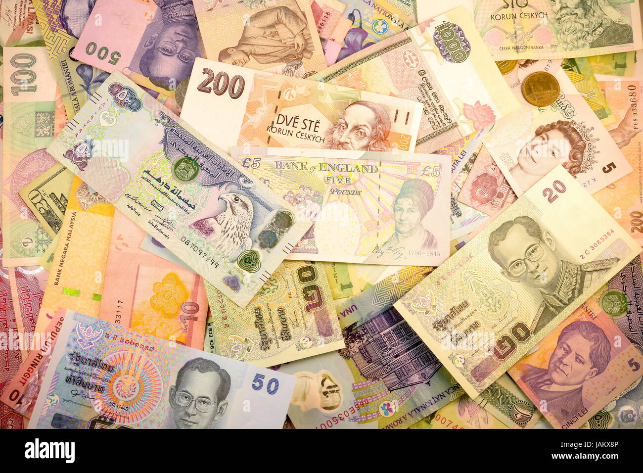 Different currency note and coins from different countries background ...