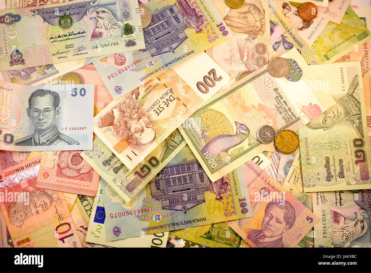 Different currency note and coins from different countries background ...