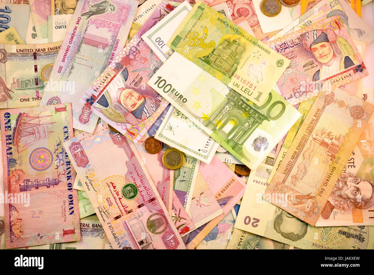 Different currency note and coins from different countries background ...