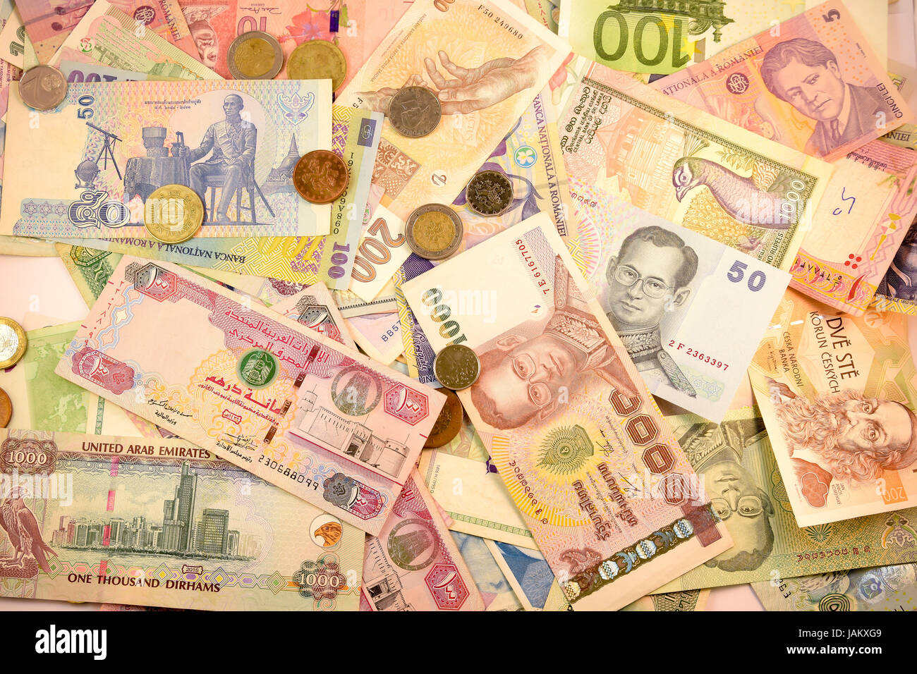 Different currency note and coins from different countries background ...