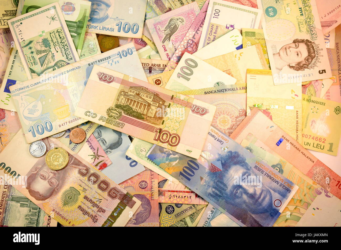 Different currency note and coins from different countries background ...