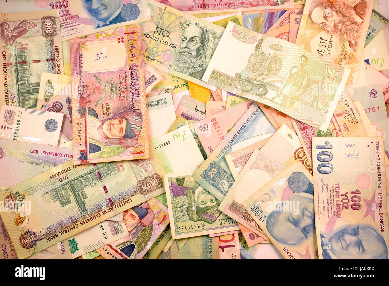 Different currency note and coins from different countries background ...