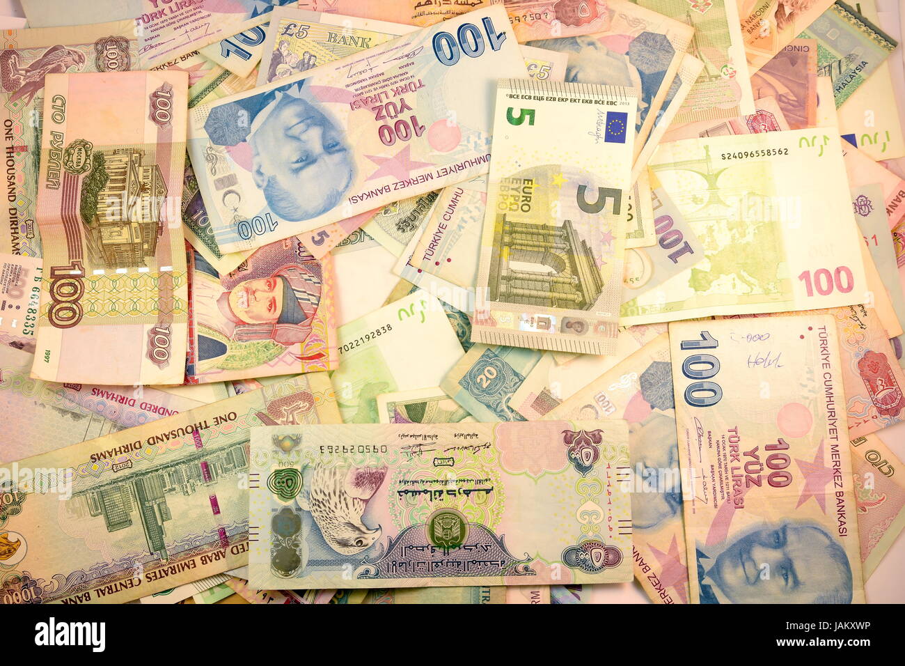 Different currency note and coins from different countries background ...