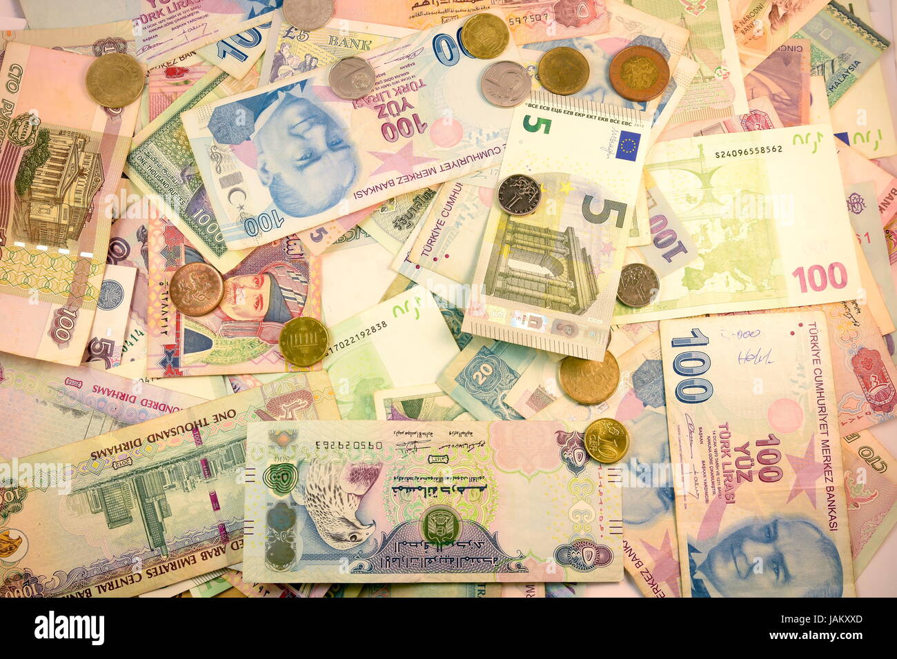 Different currency note and coins from different countries background ...