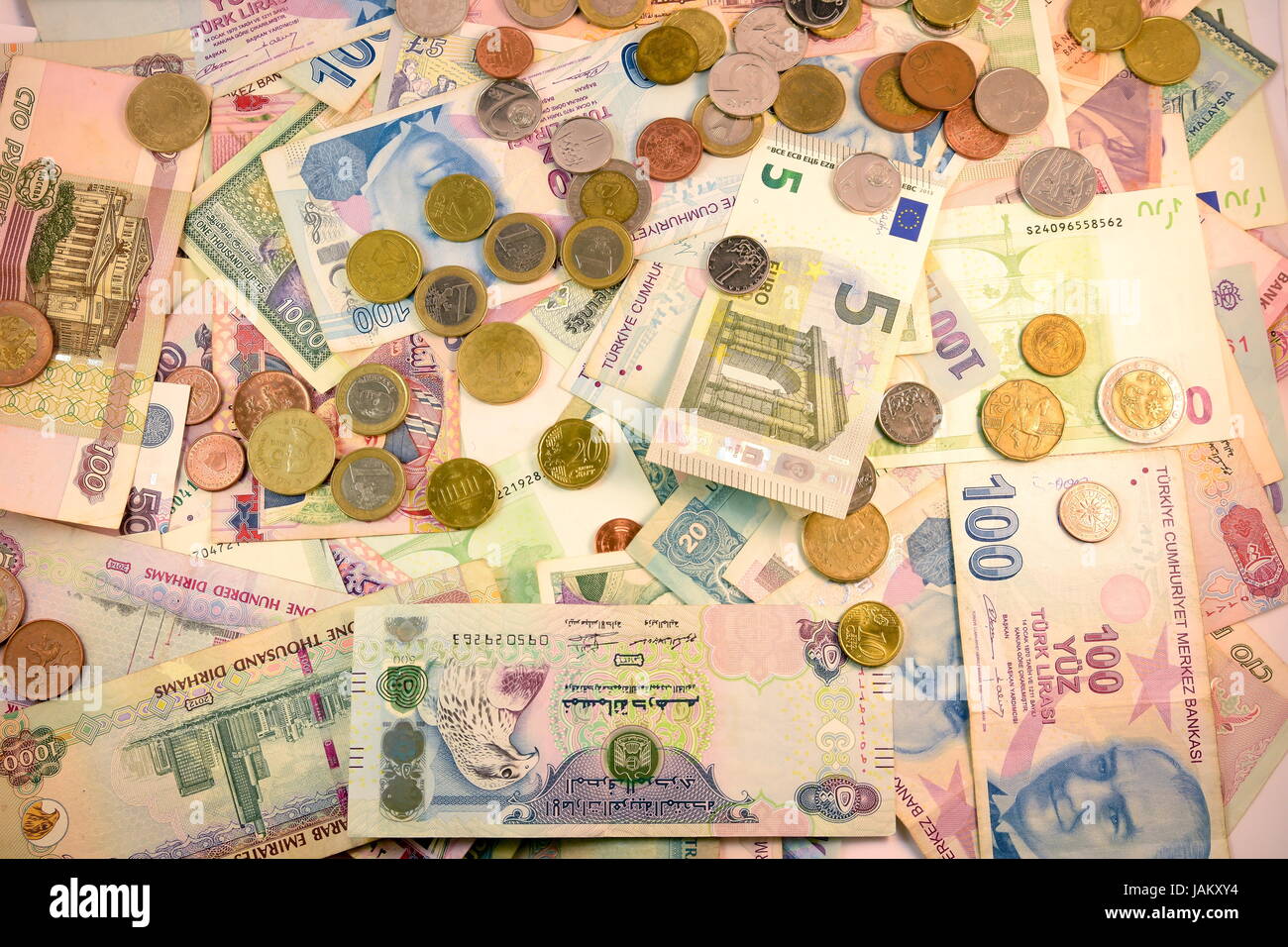 Different currency note and coins from different countries background ...