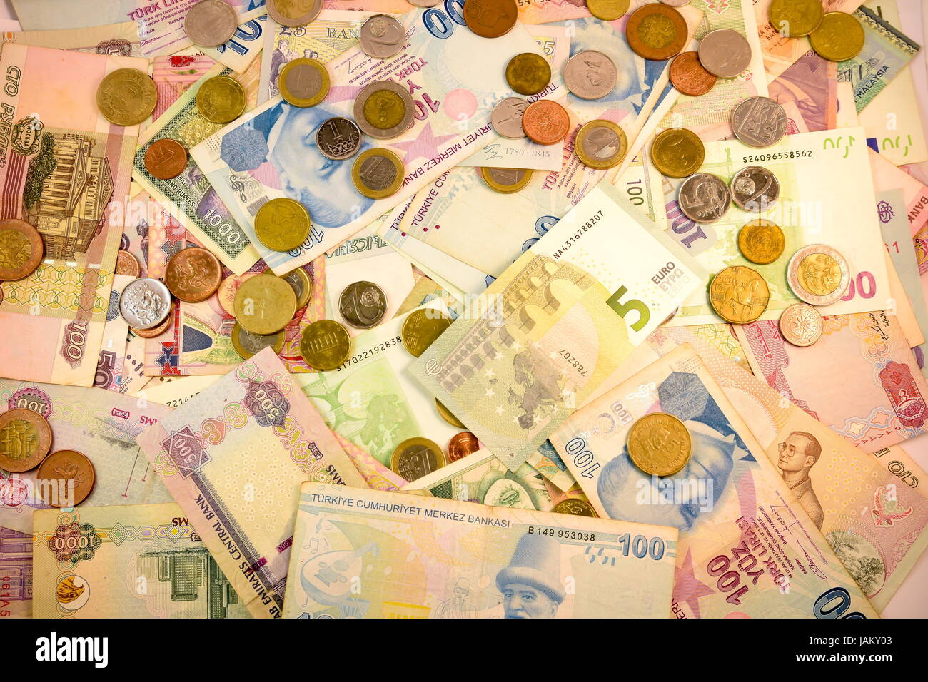 Different currency note and coins from different countries background ...