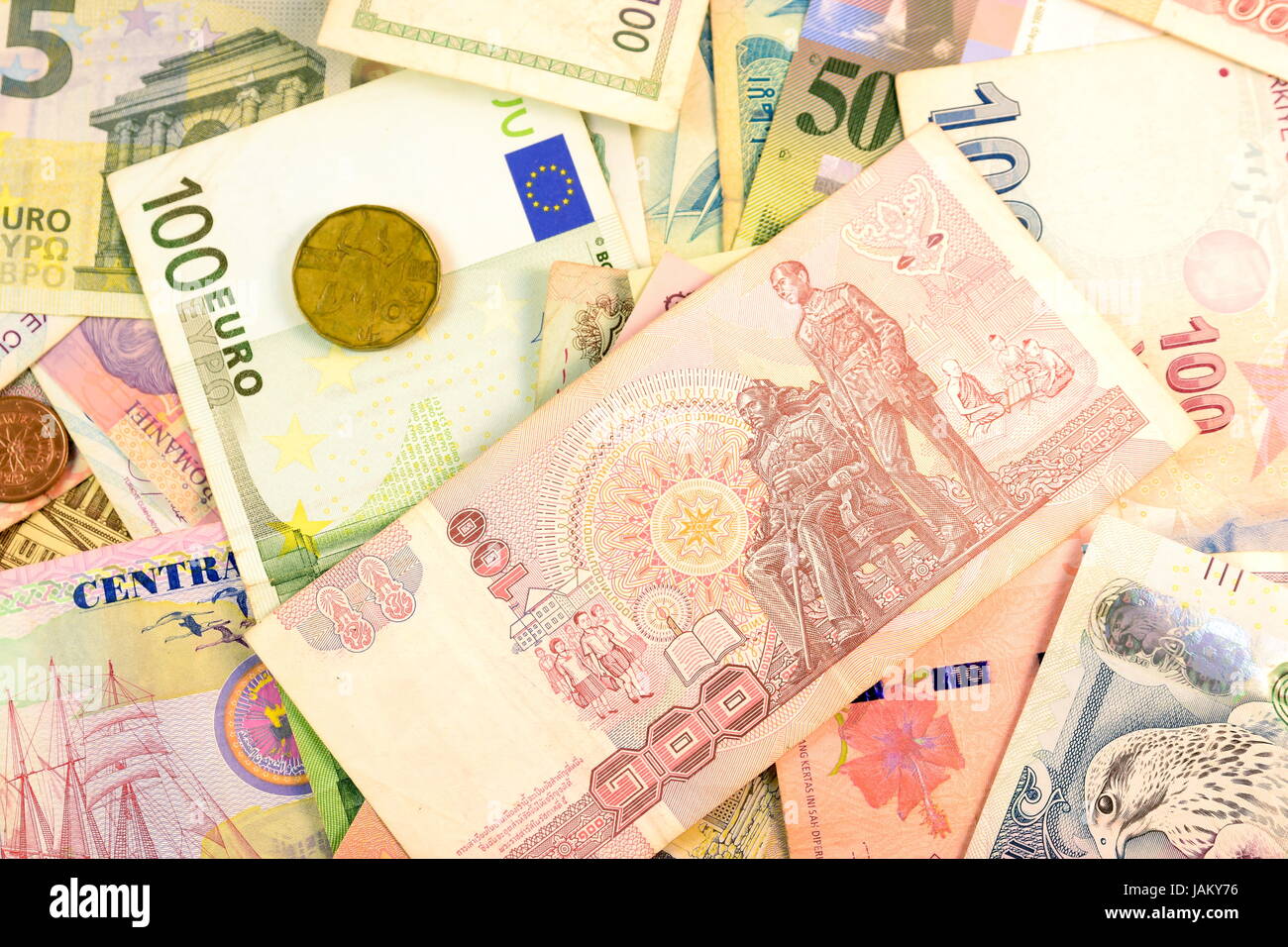 Different currency note and coins from different countries background ...