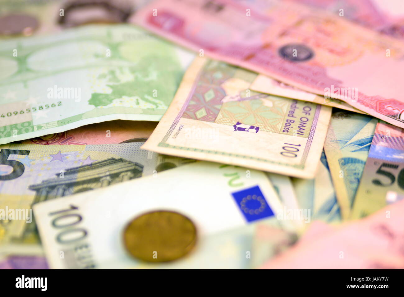 Different currency note and coins from different countries background ...