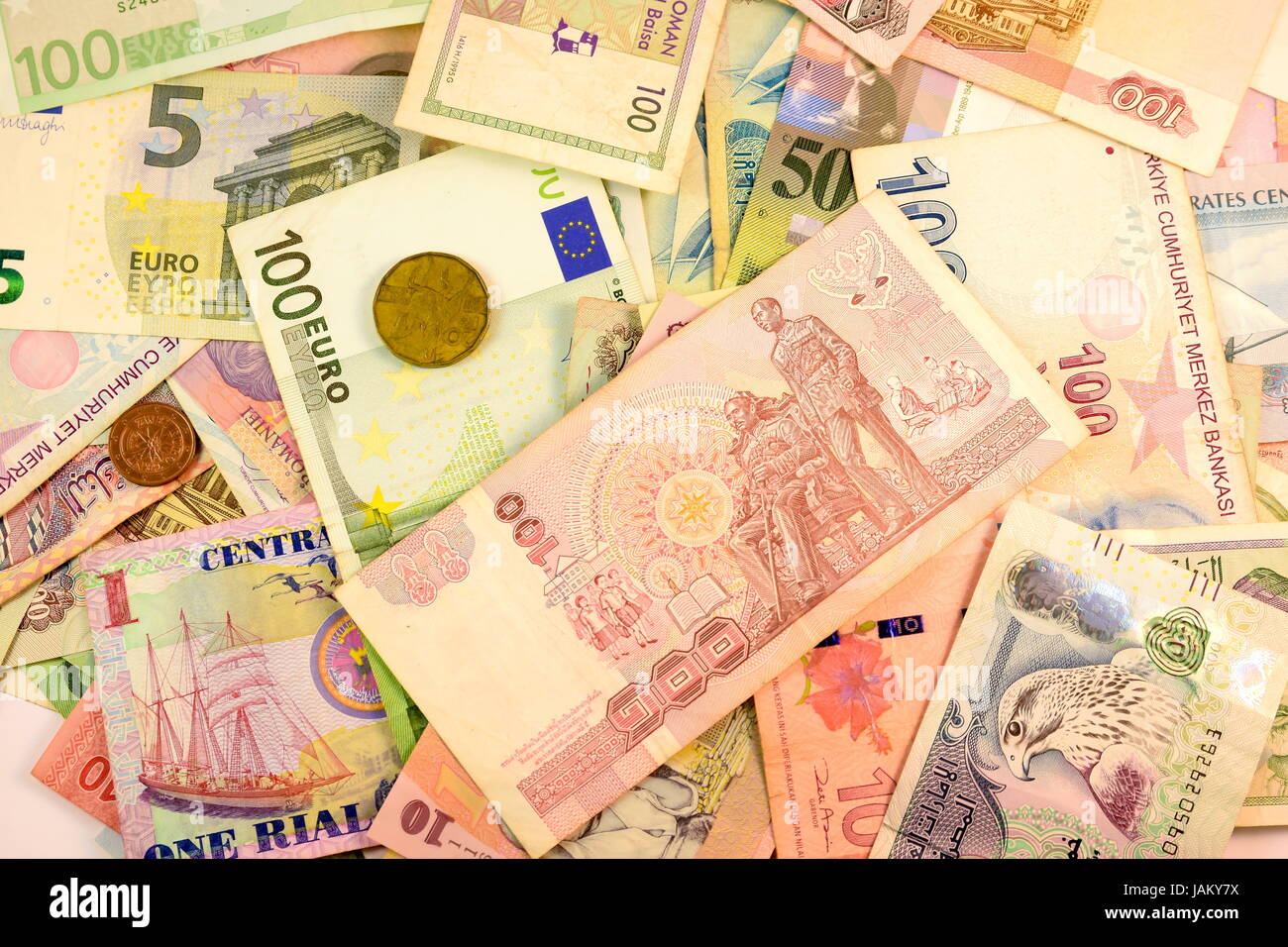 Different currency note and coins from different countries background ...