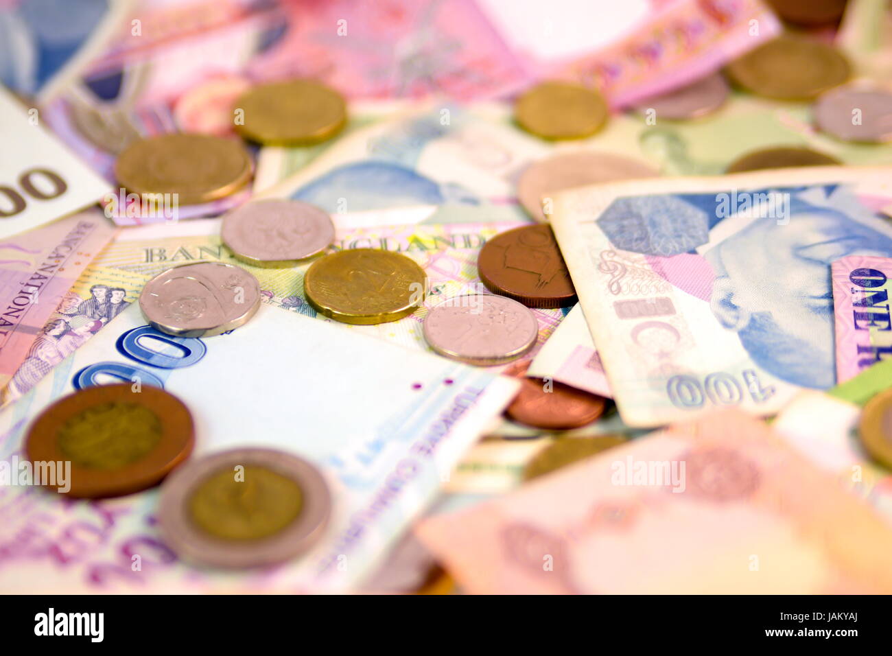 Different currency note and coins from different countries background ...