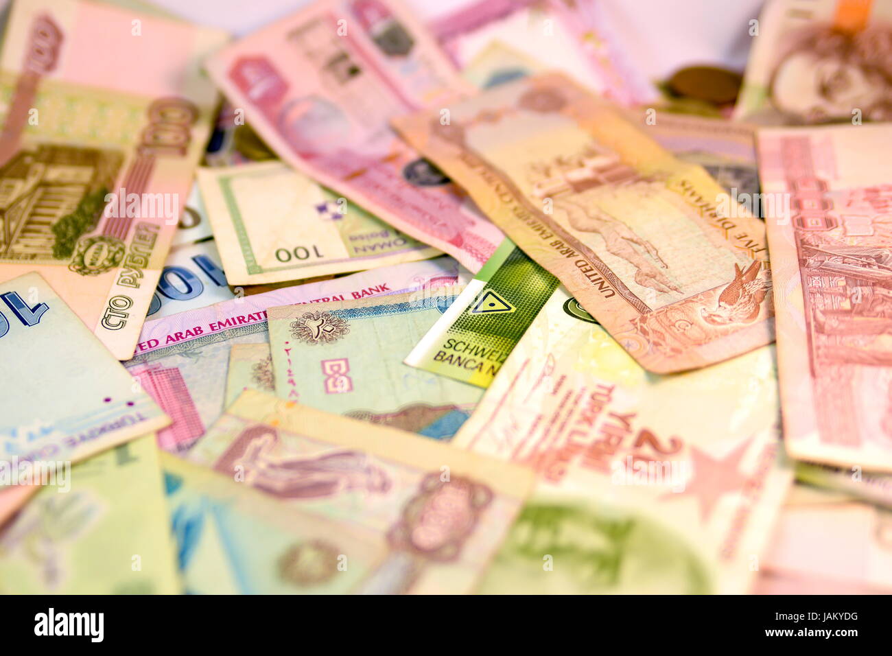 Different currency note and coins from different countries background ...