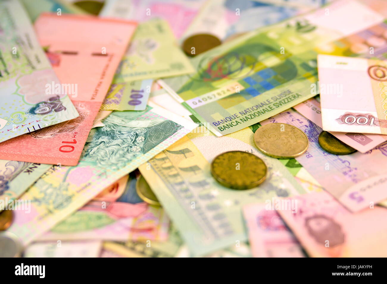 Different currency note and coins from different countries background ...