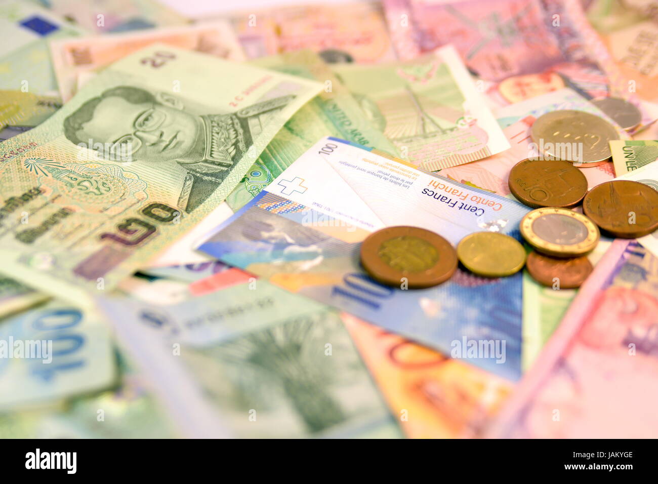 Different currency note and coins from different countries background ...