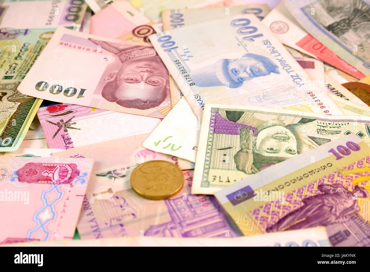 Different currency note and coins from different countries background ...