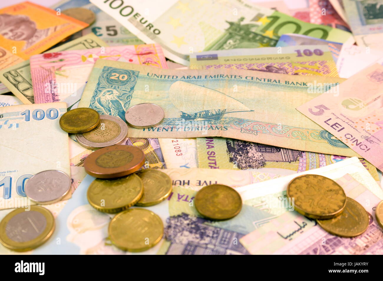 Different currency note and coins from different countries background ...