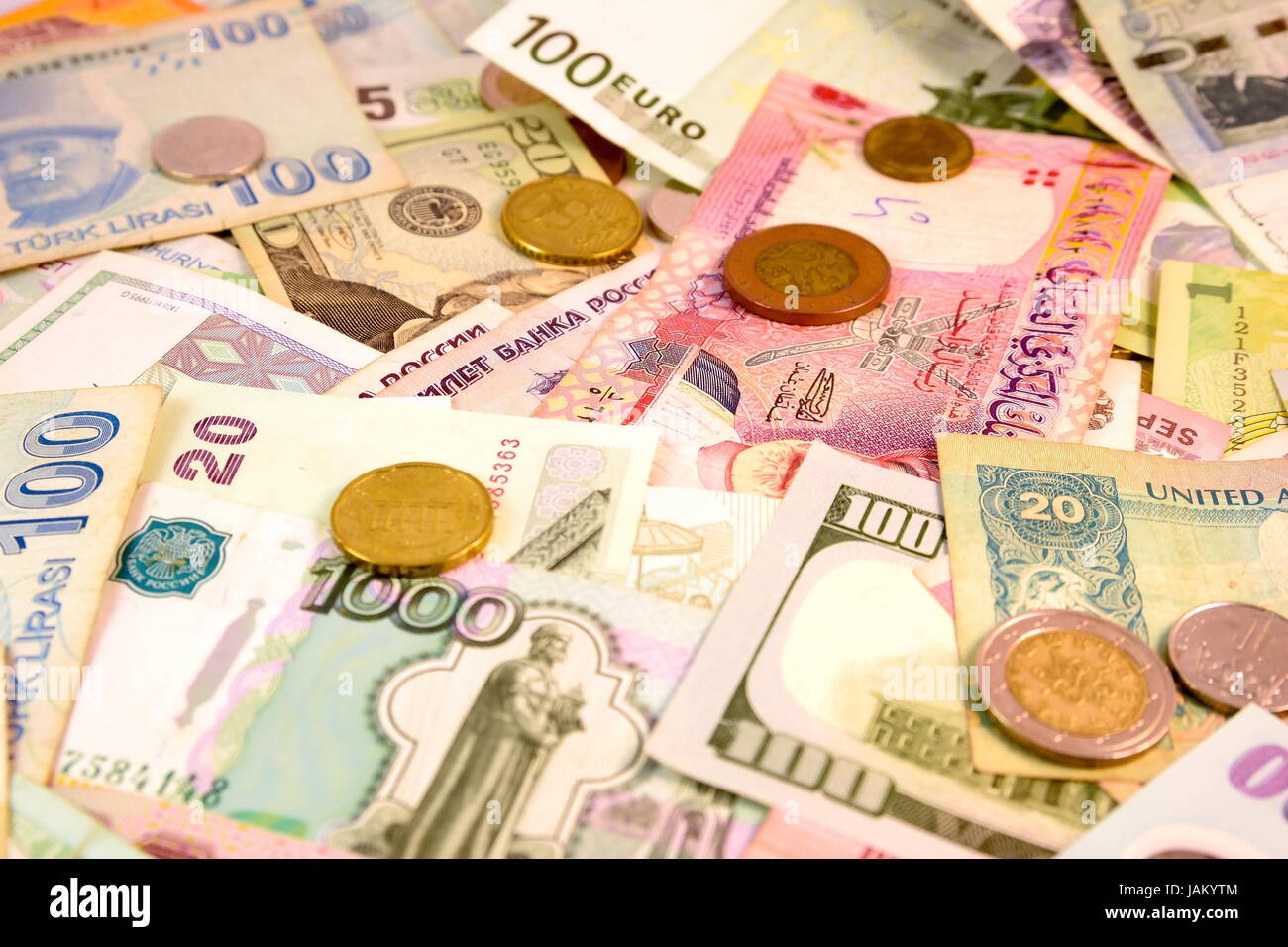 Different currency note and coins from different countries background ...