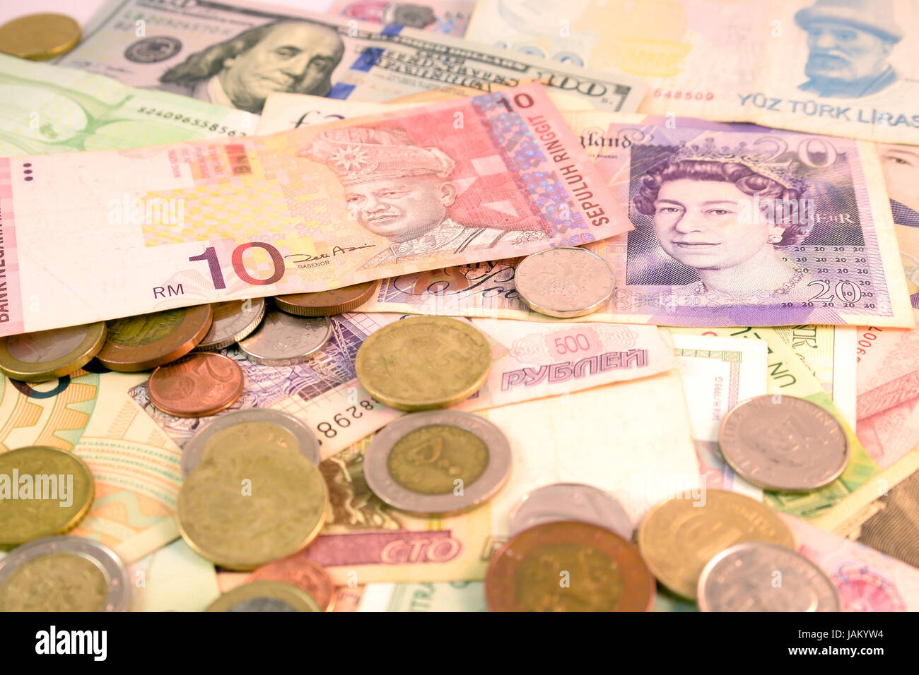 Different currency note and coins from different countries background ...