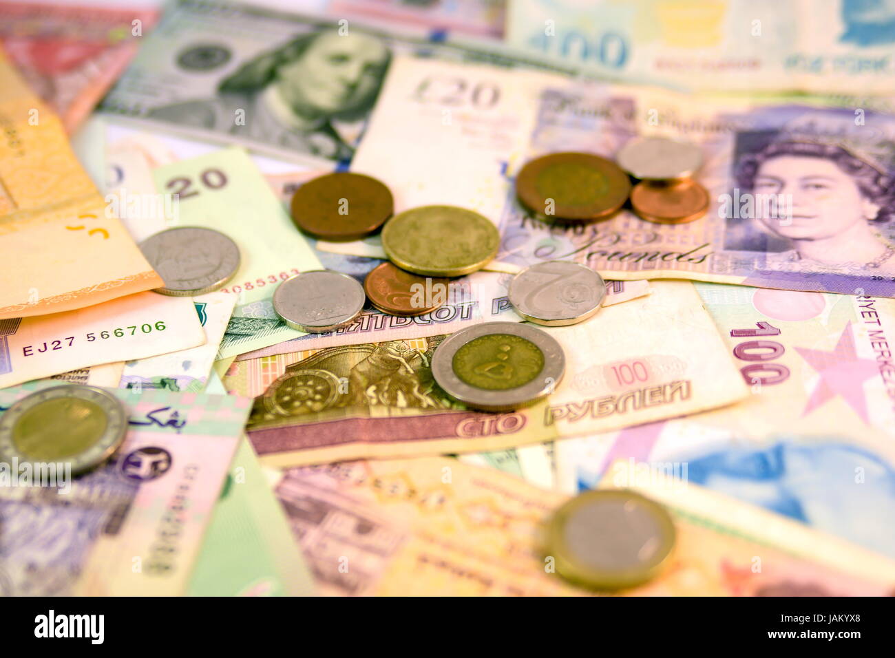 Different currency note and coins from different countries background ...