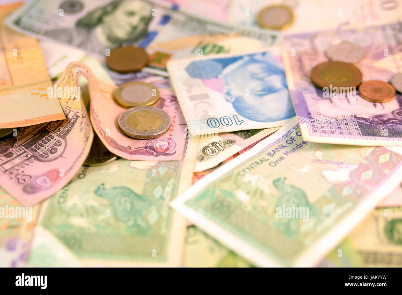 Different currency note and coins from different countries background ...