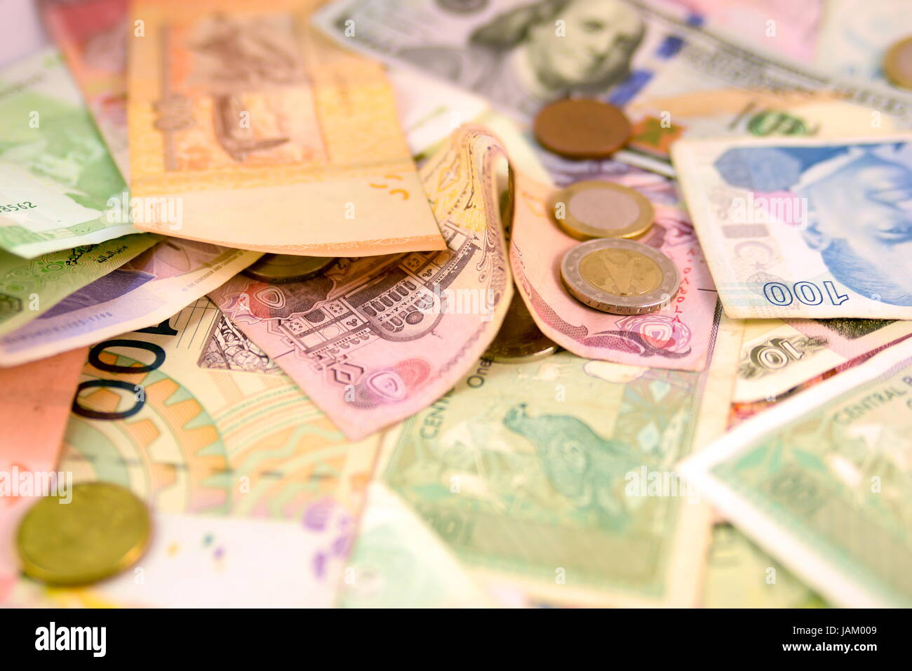 Different currency note and coins from different countries background ...