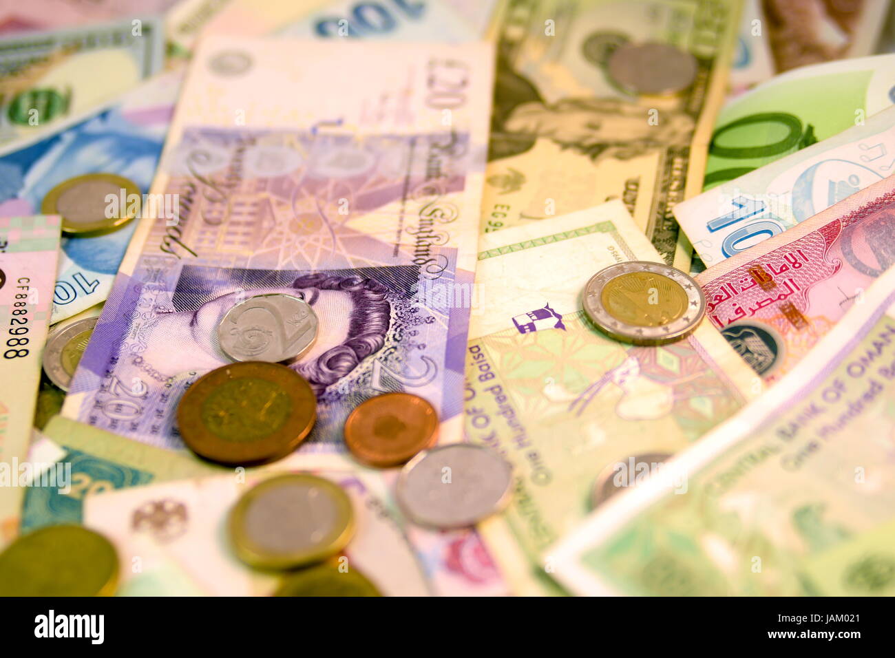 Different currency note and coins from different countries background ...