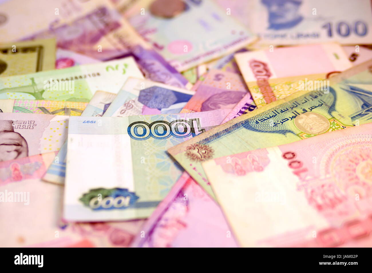 Different currency note and coins from different countries background ...