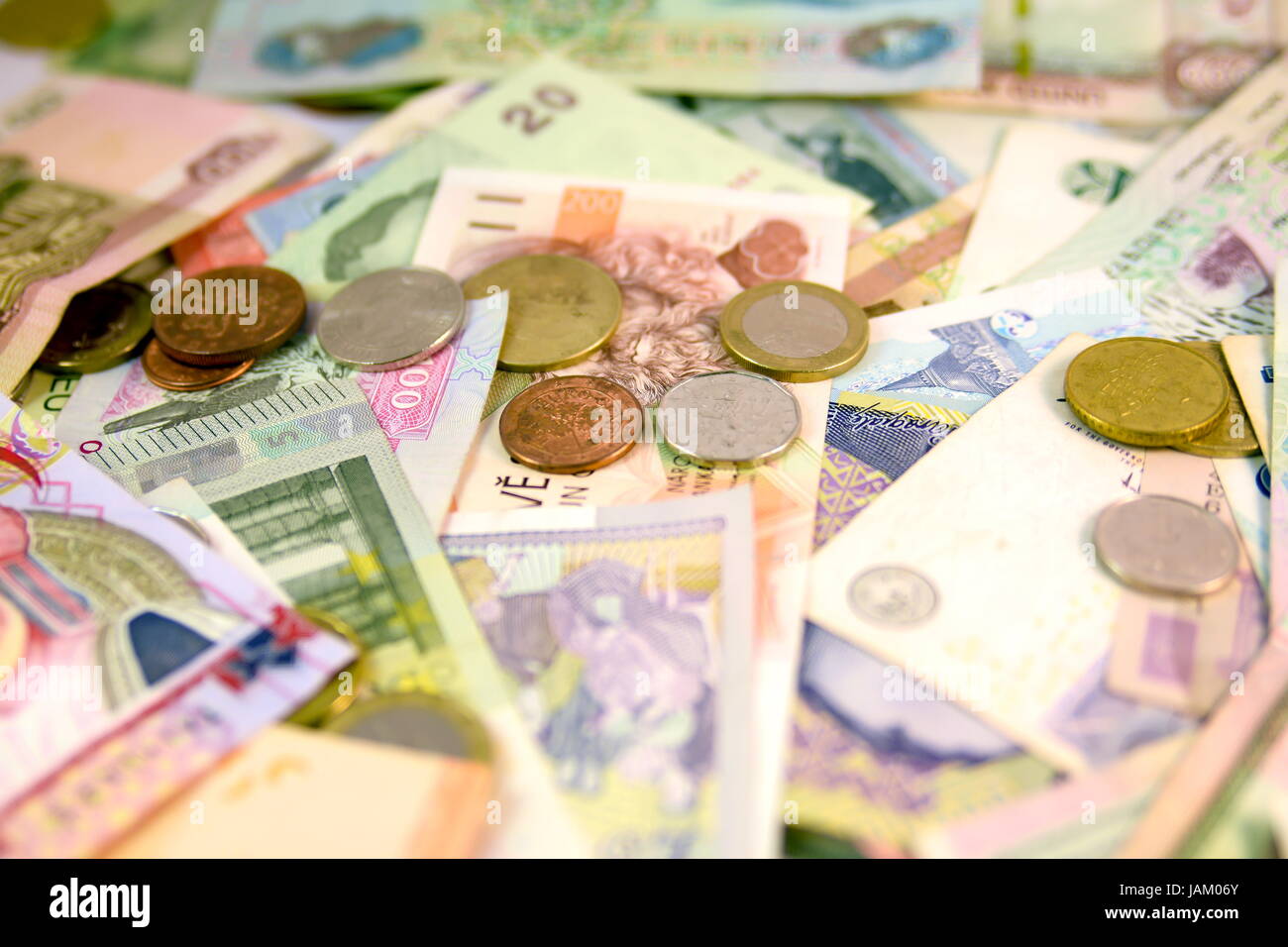 Different currency note and coins from different countries background ...