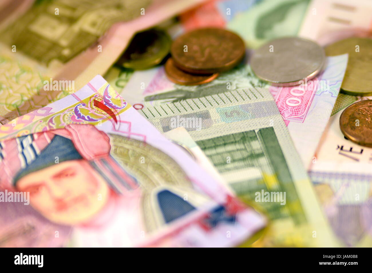 Different currency note and coins from different countries background ...