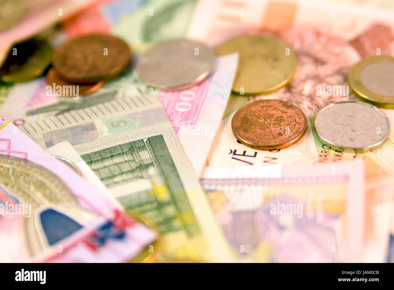 Different currency note and coins from different countries background ...