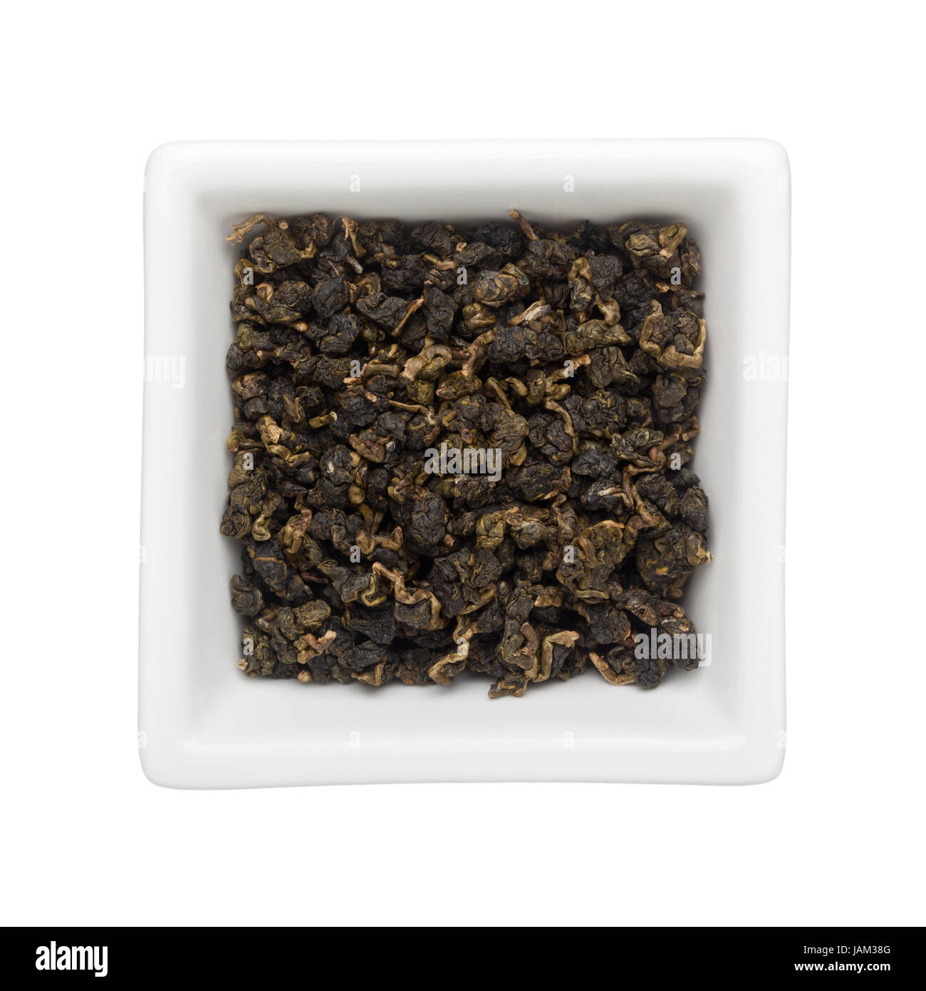 Oolong tea leaves in a square bowl isolated on white background Stock ...