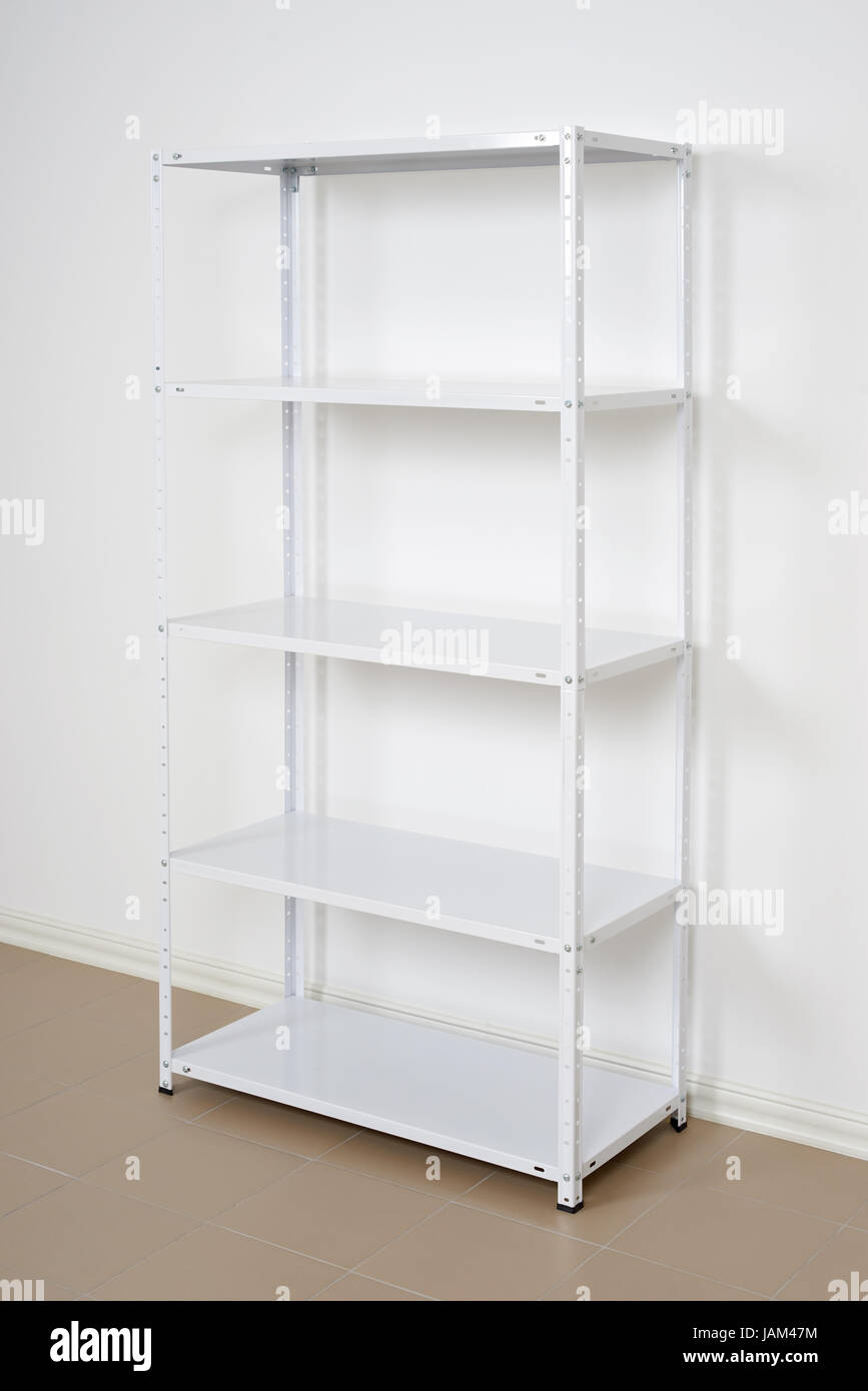 white metal rack near the wall, empty shelves Stock Photo - Alamy