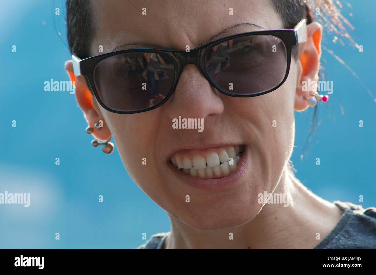 Girl with sunglasses on blurry background Stock Photo - Alamy
