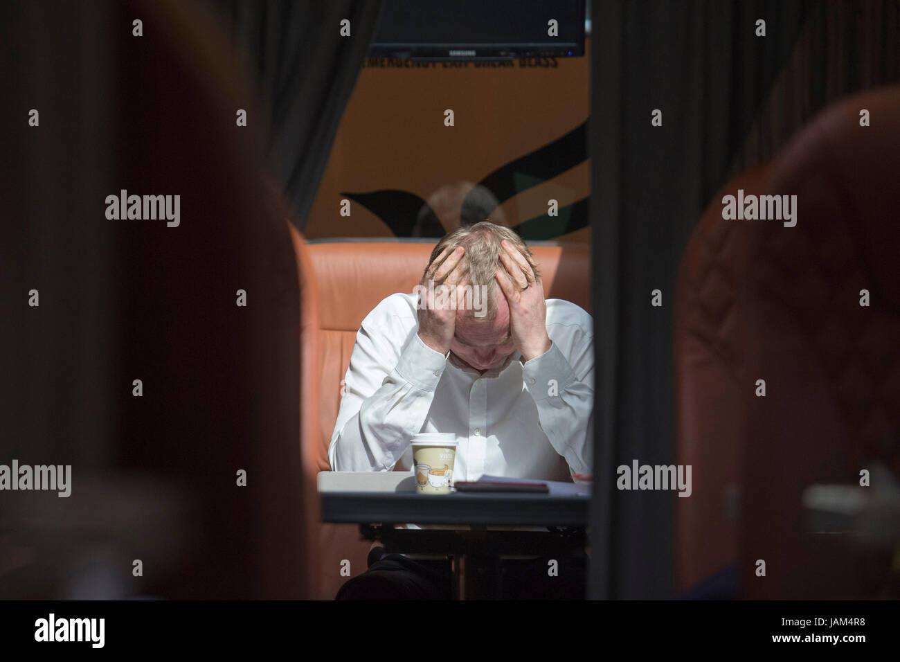 Liberal Democrats leader Tim Farron works on the battle bus during the ...