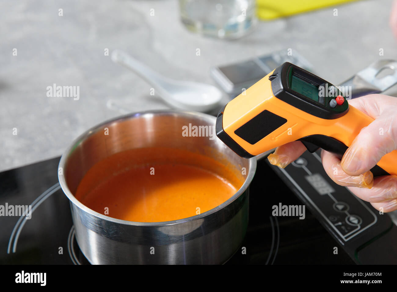 measuring the temperature of cream soup by digital thermometer Stock ...