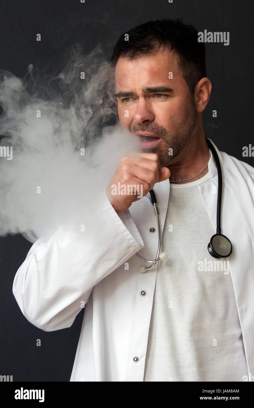 portrait of handsome doctor smoking and coughing Stock Photo - Alamy