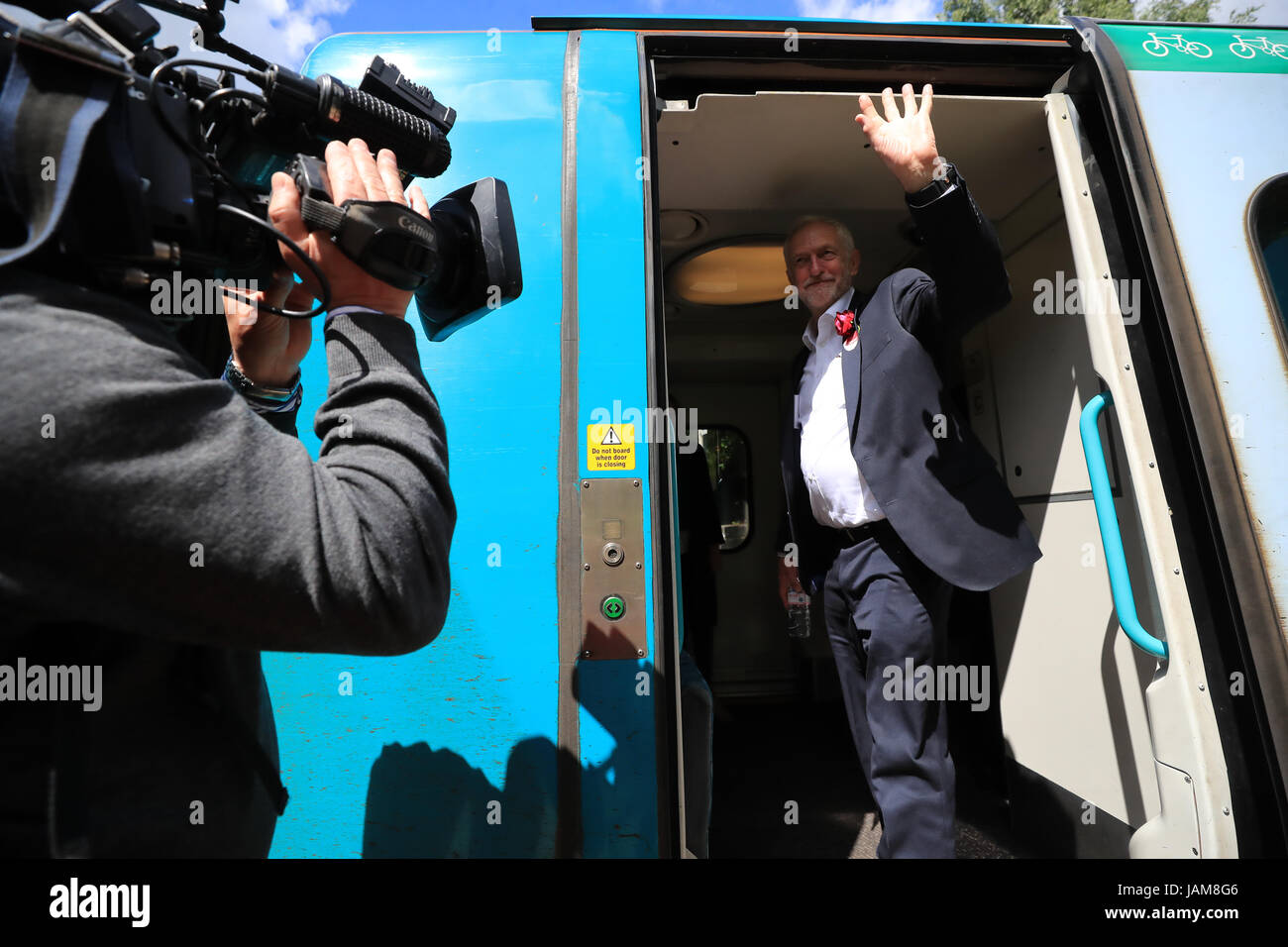 Labour leader Jeremy Corbyn boards a train at Runcorn East railway ...
