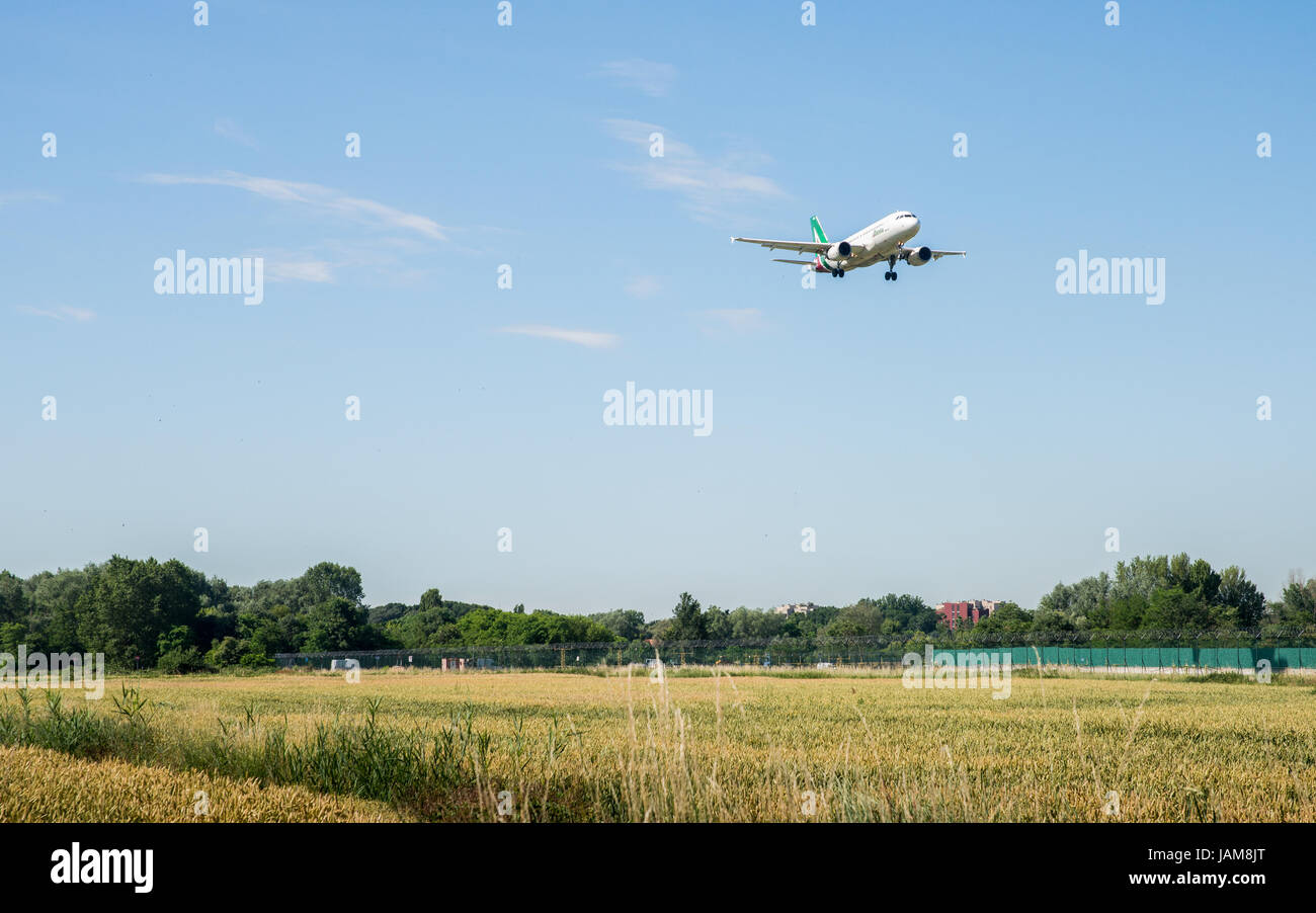 Commercial airplane lands at Milan's Linate Airport in Italy Stock ...