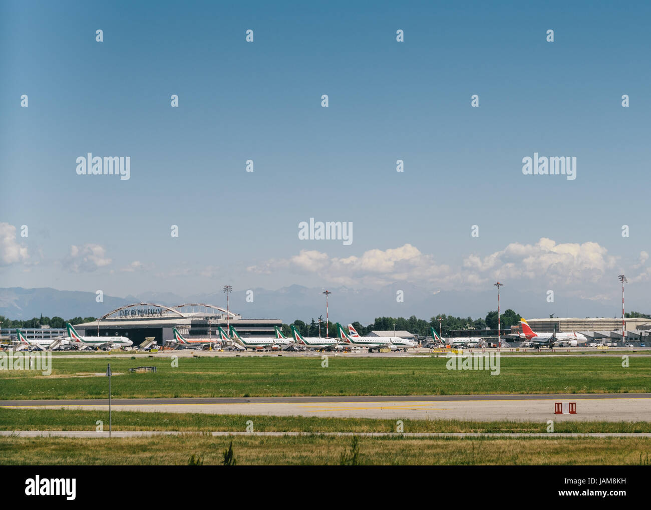 Commercial airplanes at Milan's Linate Airport in Italy during a ...