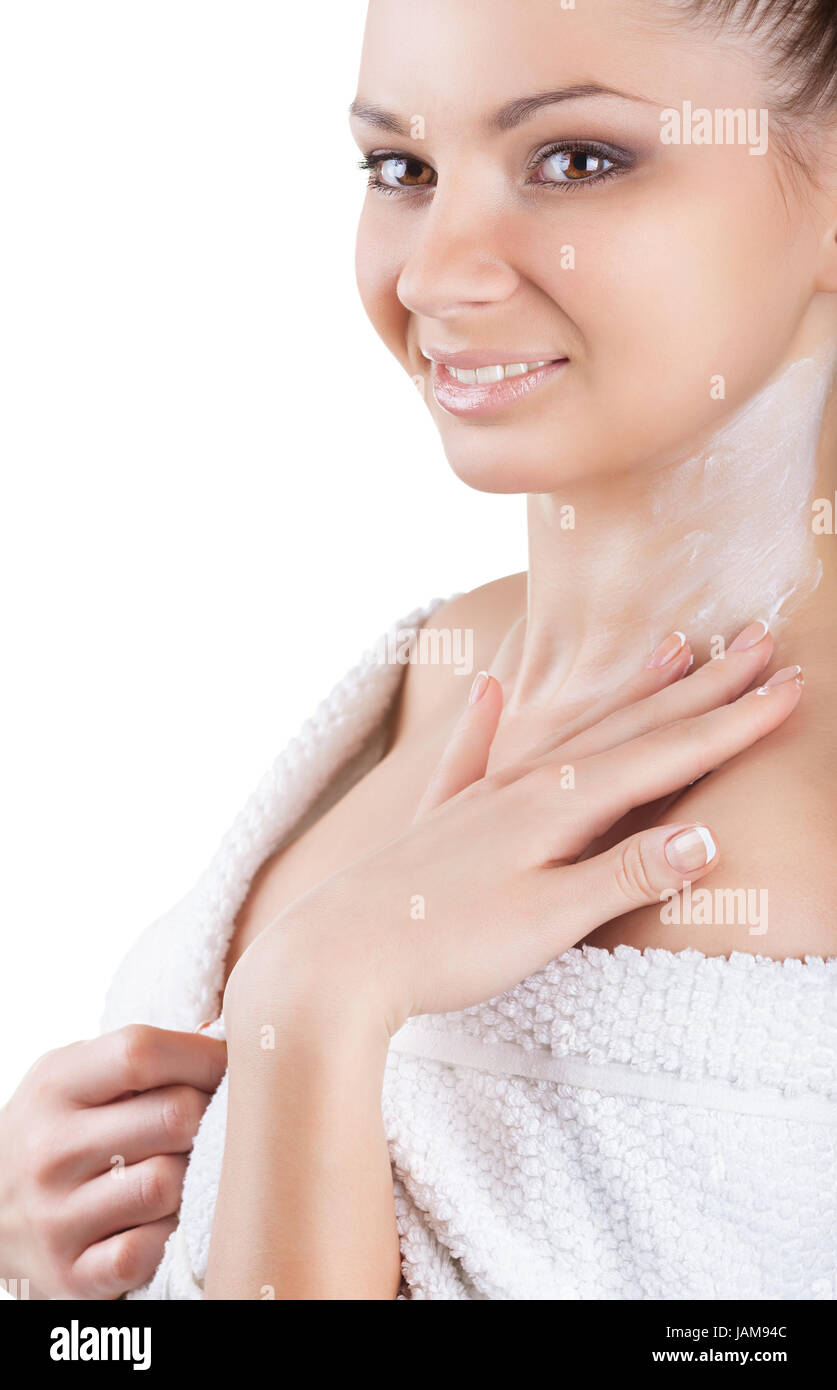 Close-up beautiful woman applying moisturizer cosmetic cream on neck ...