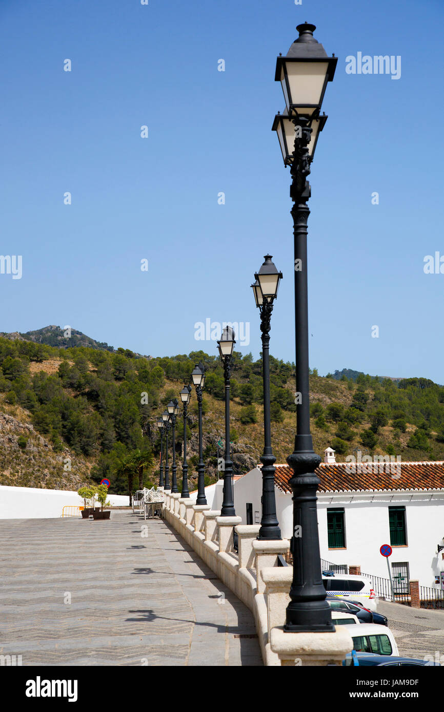 A row of ornate street lights alongside a 16th Century honey factory in ...