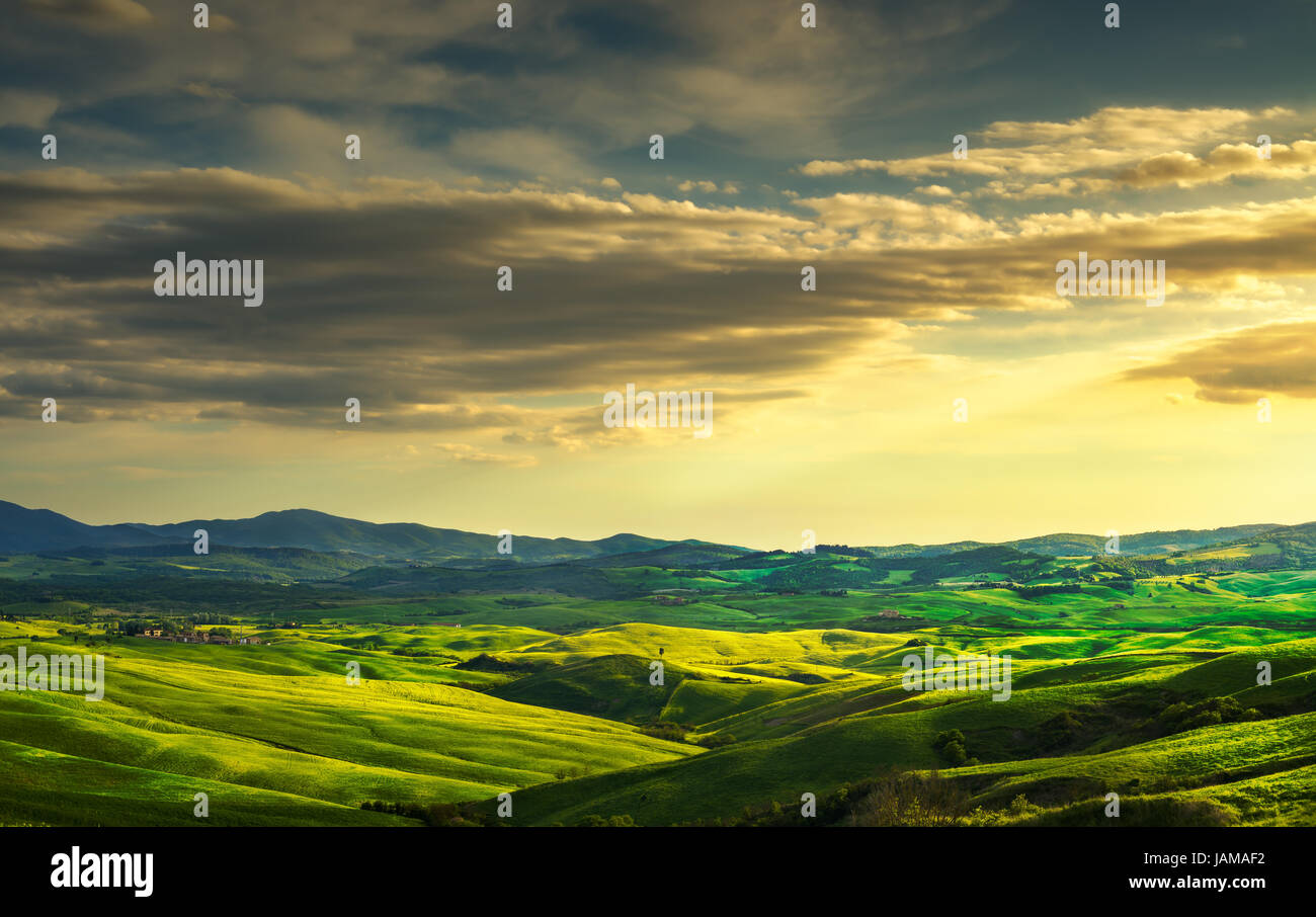 Volterra panorama, rolling hills and green fields on sunset. Rural ...