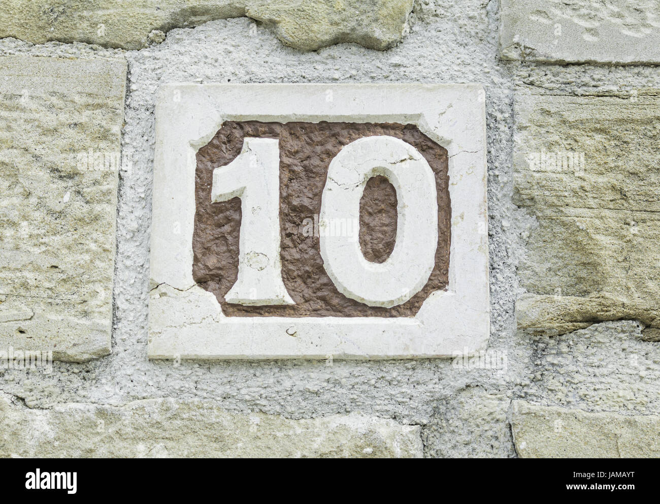 Number ten stone in front of building, construction and architecture ...