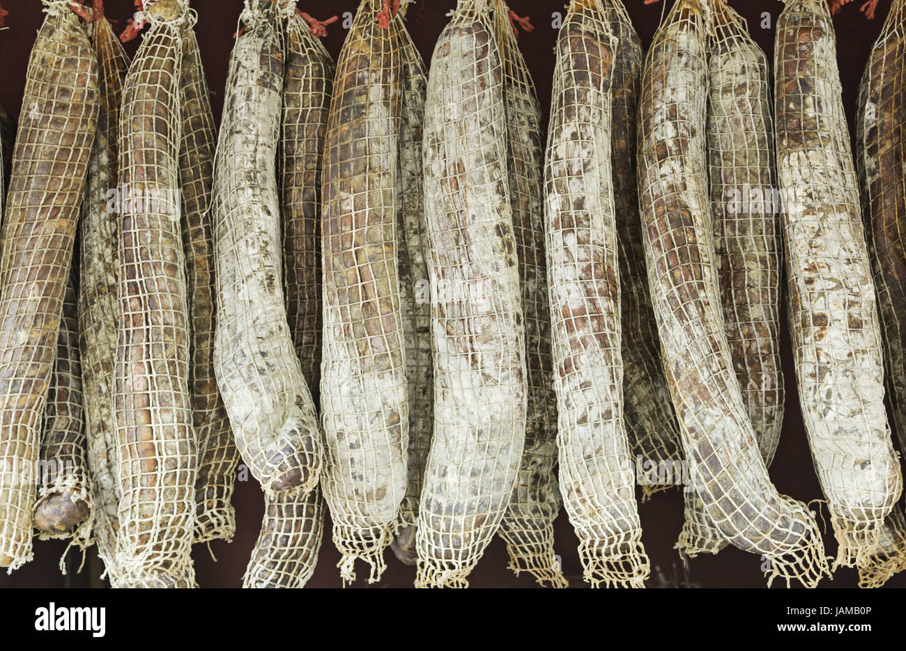Pork loin hanging in deli, meal and food Stock Photo - Alamy