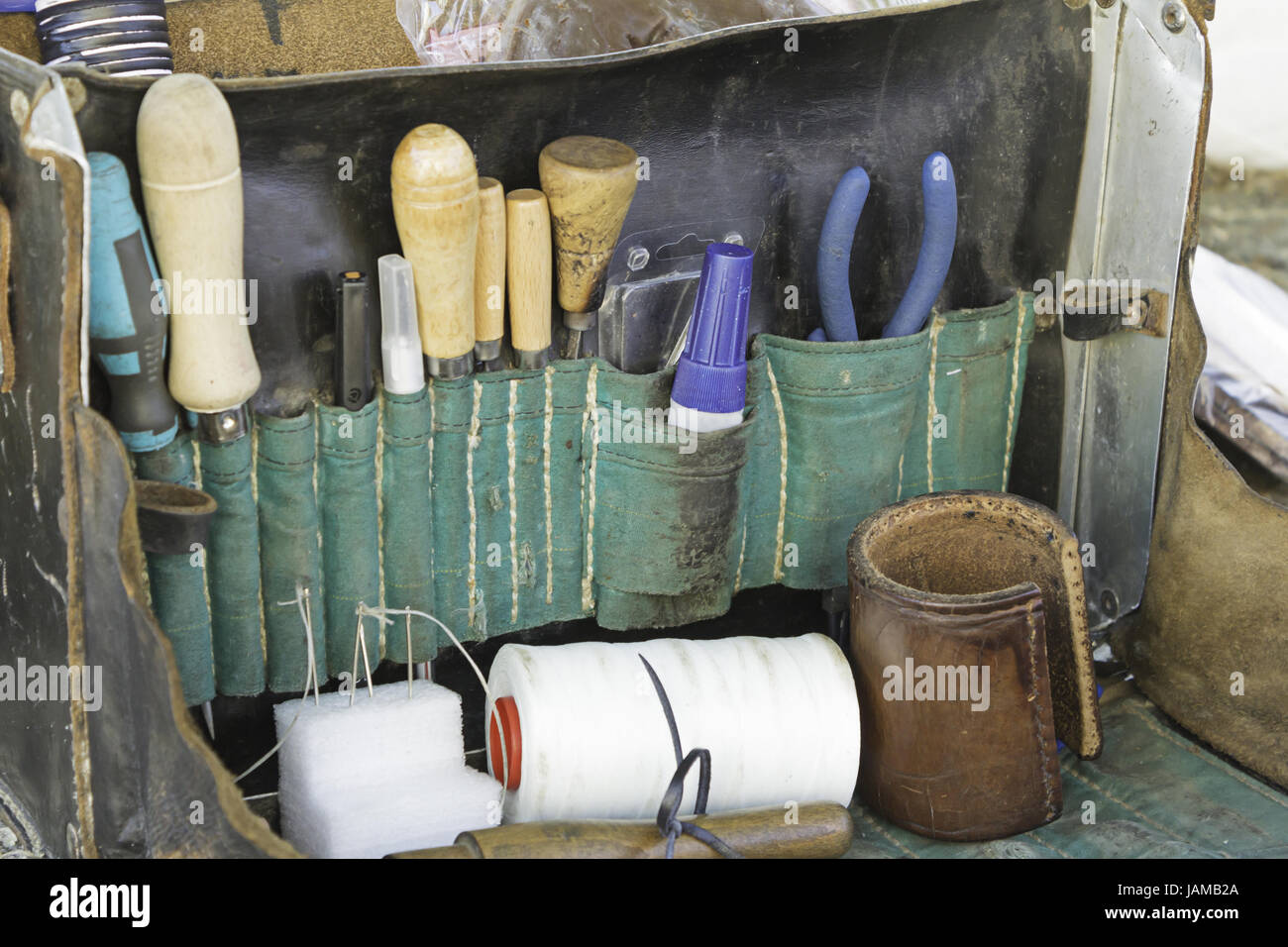 Tools tanners leather briefcase, industry Stock Photo - Alamy