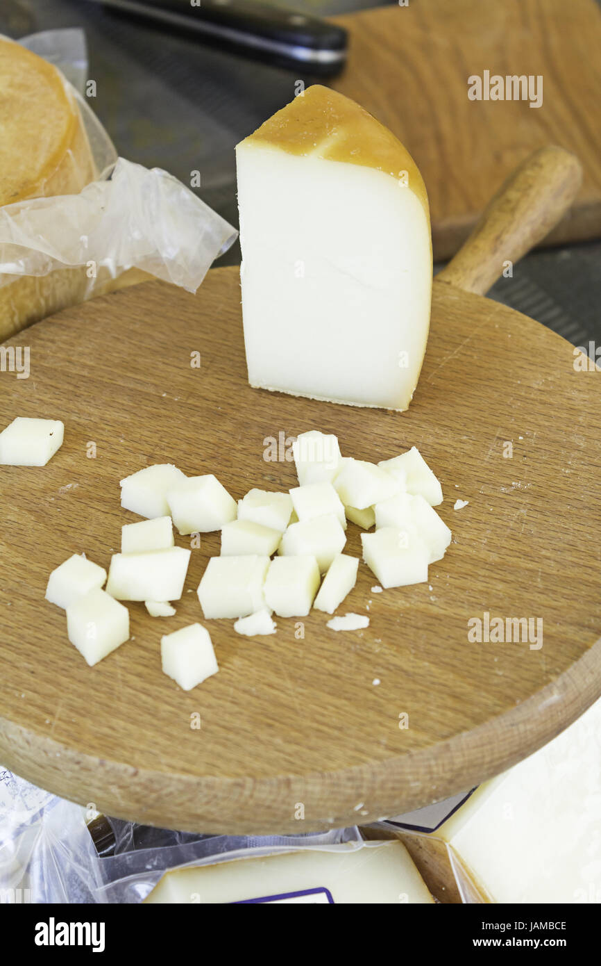 Curing cheese wedge feed market, food Stock Photo - Alamy