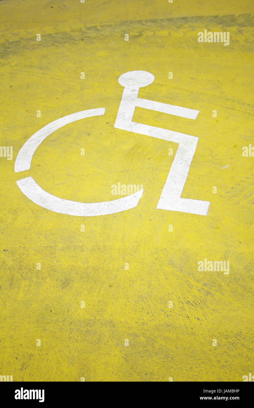 Disabled road sign in yellow, signage and symbol Stock Photo - Alamy